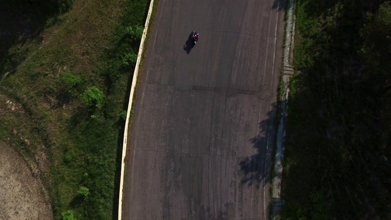 top view motorcycle rider riding on racing track motorcyclist training ...
