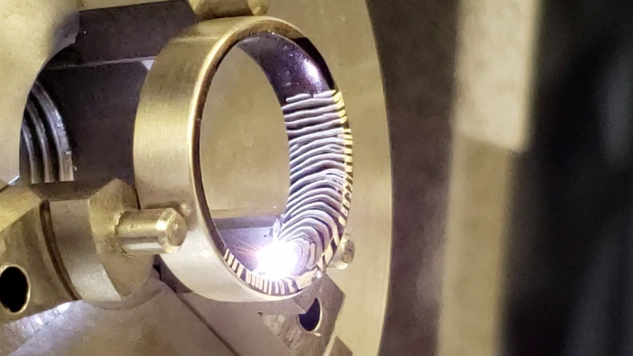 Laser engraving fingerprints inside platinum wedding band with Z Tech's ...