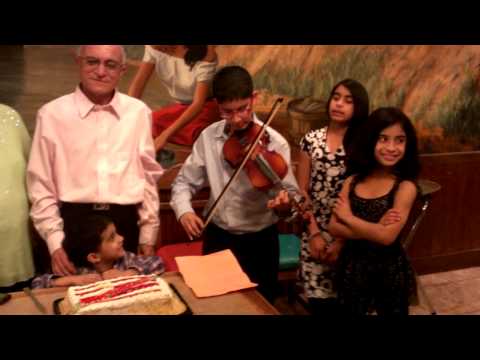 Naail playing happy birthday for his Dada.