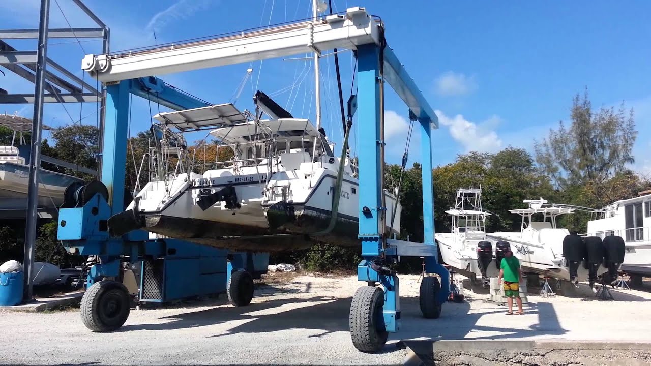 Lifting Gemini 105MC for bottom paint and repower - YouTube