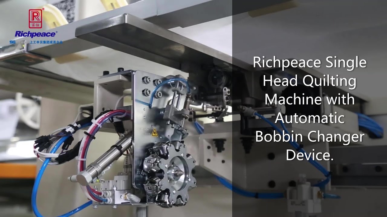 How does an automatic bobbin changing device work on a quilting machine ...