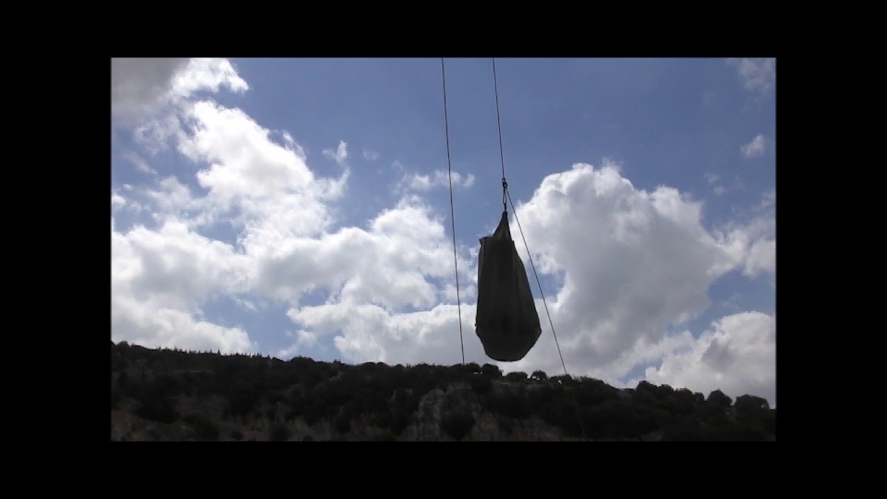 Salvaging ancient pottery from cliffside Galilee cave - YouTube