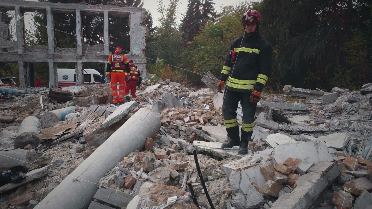 Broken building with emergency service workers - YouTube