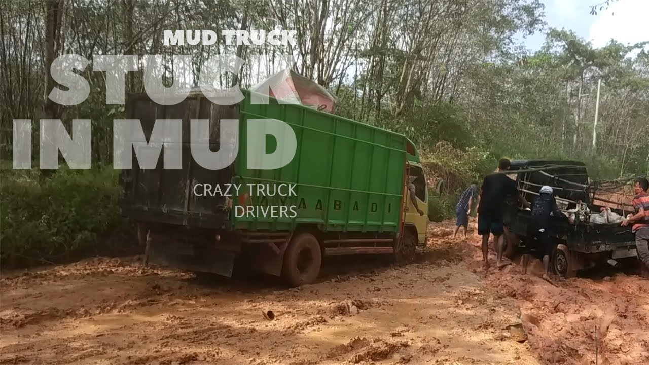 trying to get out of being stuck on a muddy road, mud truck, crazy ...