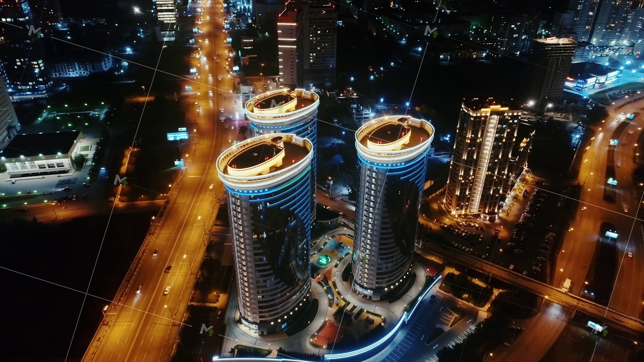 Top view of the night city. Beautiful modern buildings on the ...