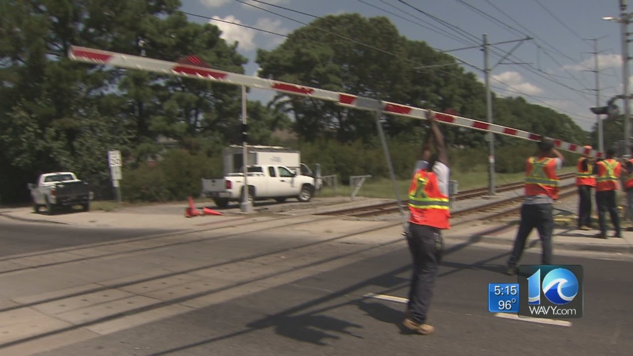 Car hits light rail gate - YouTube