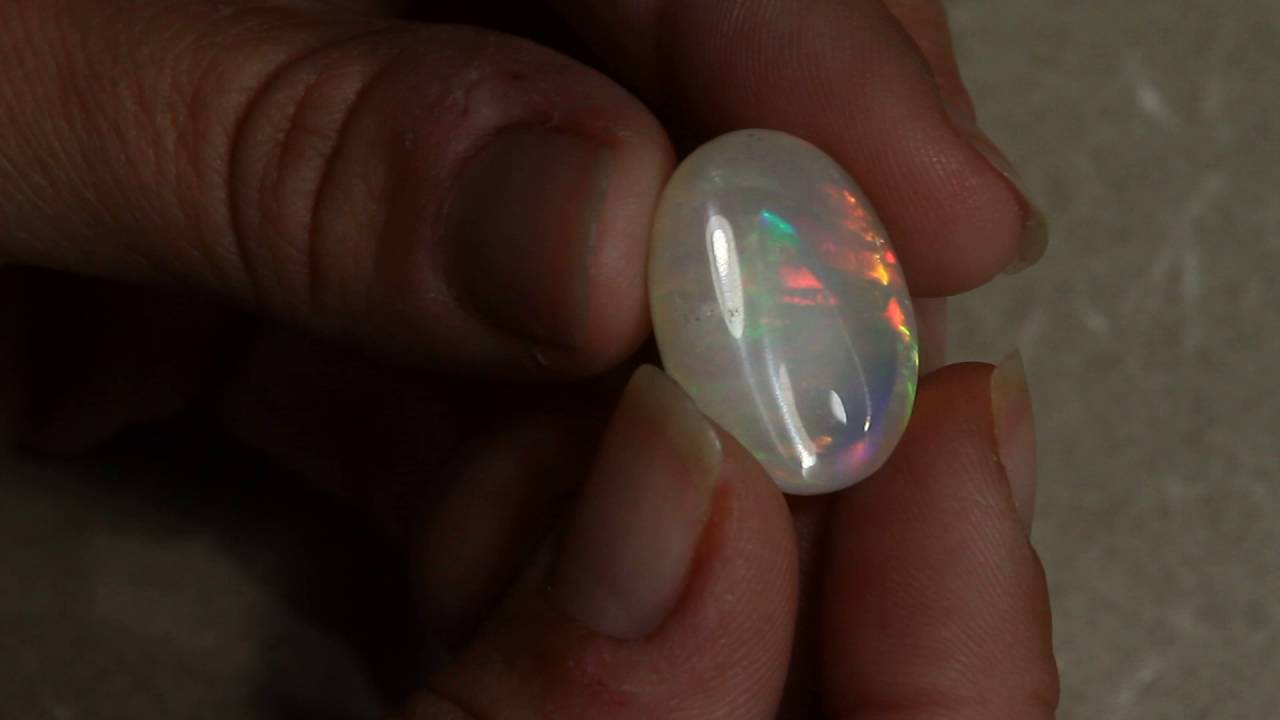 opal 21.20 carat oval cabochon - YouTube