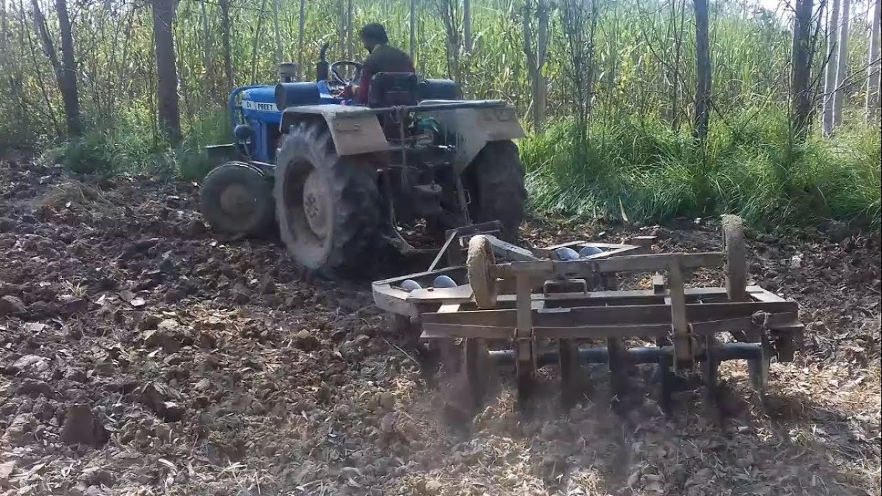 Tractor agriculture in india /ploughing by tractor harrow in india ...