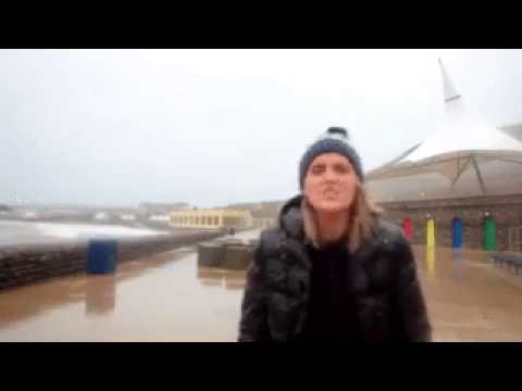 Reporter hit by fish - YouTube