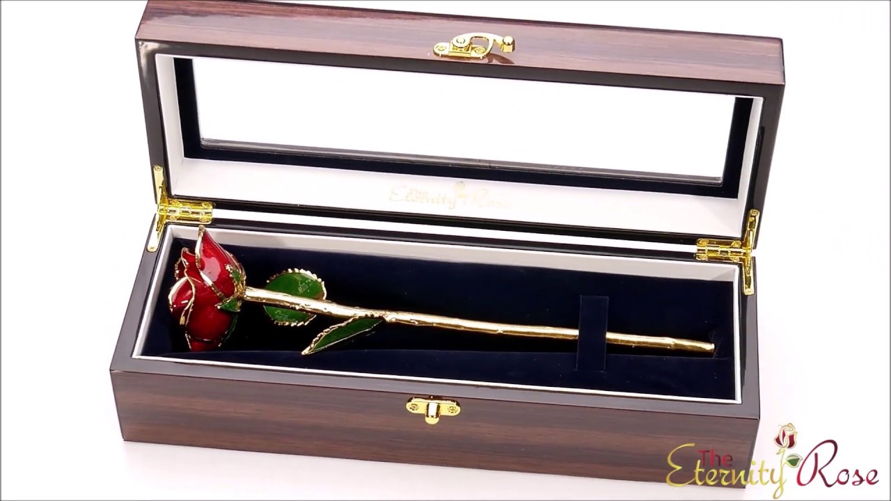 A natural red rose, glazed and gold trimmed. Presented in a high gloss ...