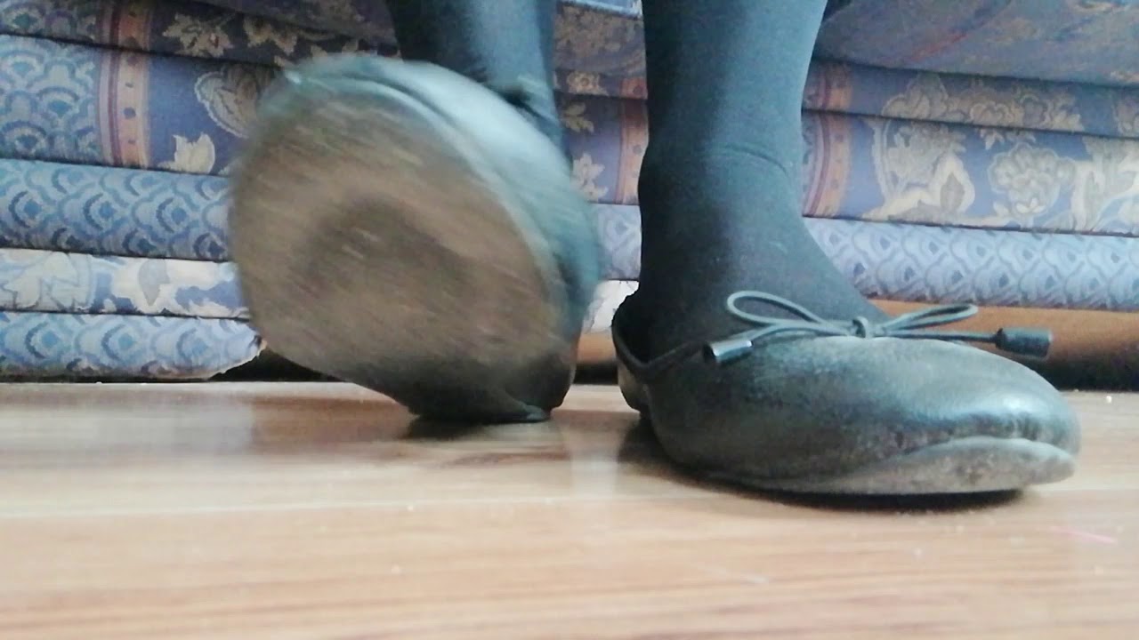 Toe tapping in black ballet flats close up - YouTube