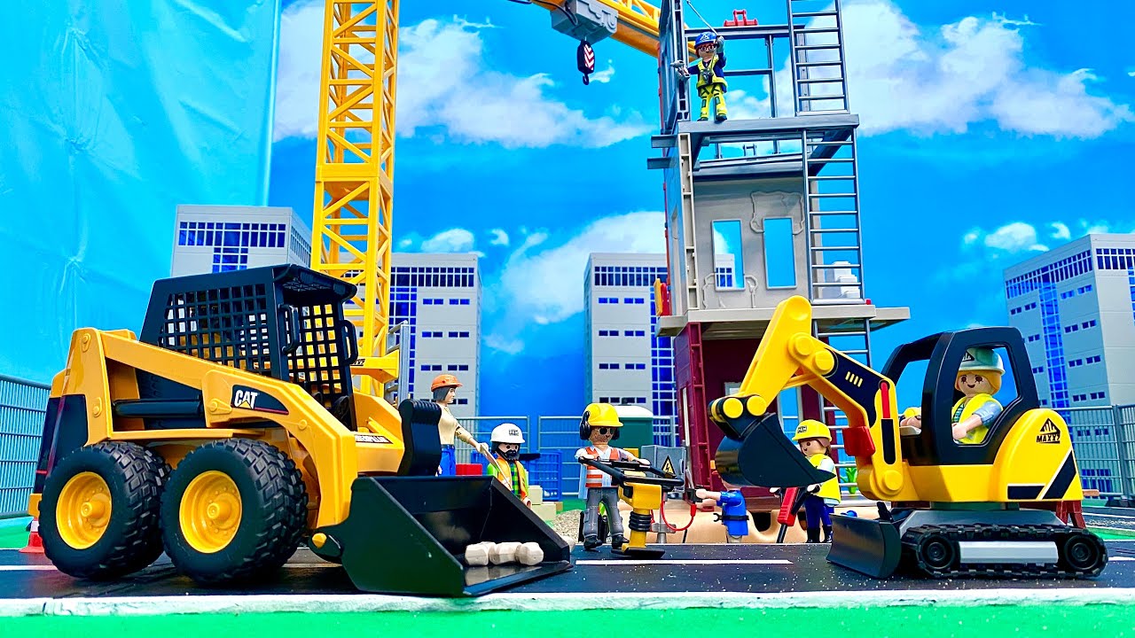 Working on a construction site. Construction toys in action in the big ...