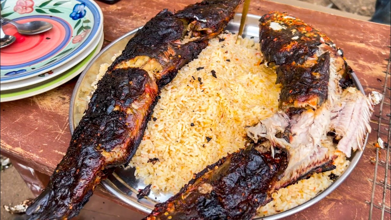 Eating Grilled Catfish And Jollof Rice With Friends - YouTube