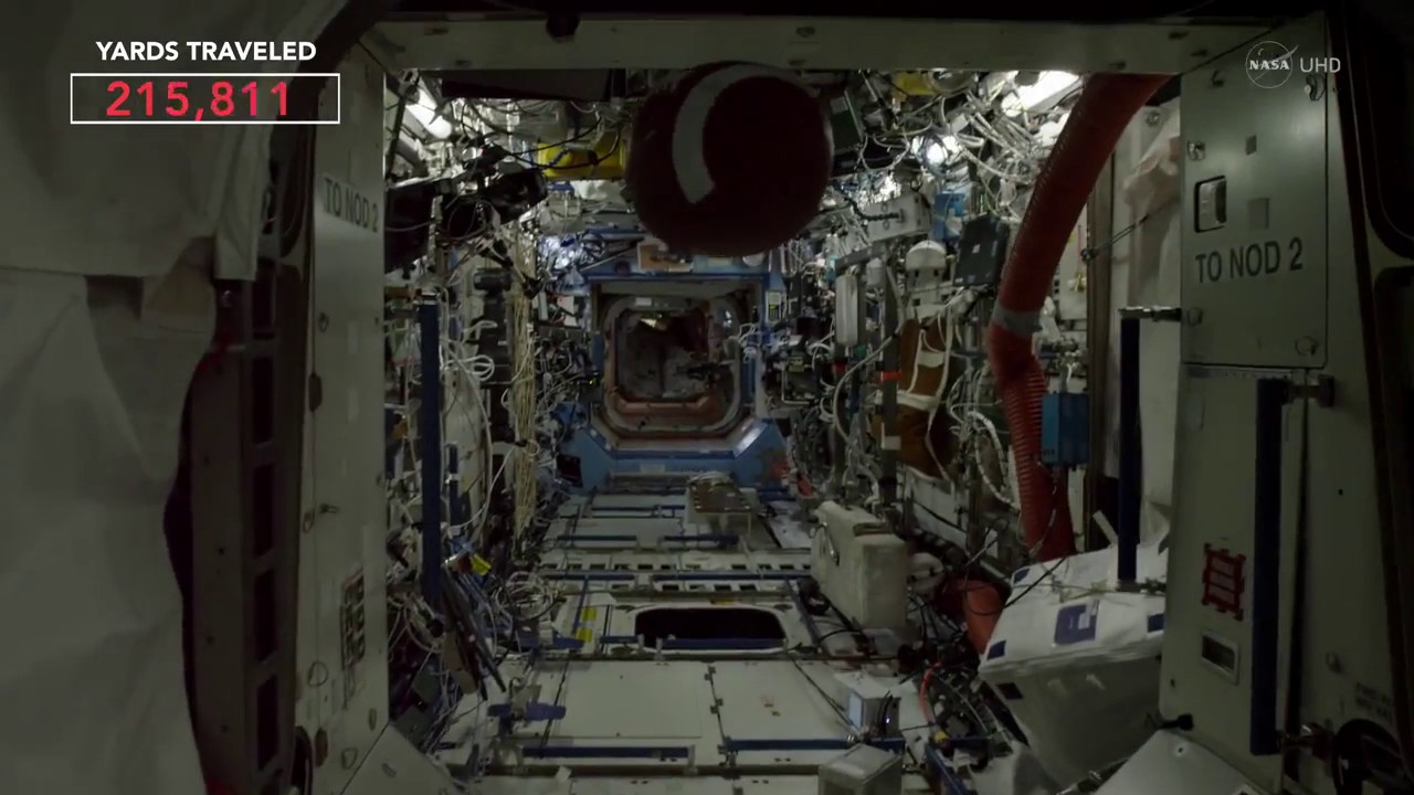 ISS astronaut throws longest ever football pass - YouTube