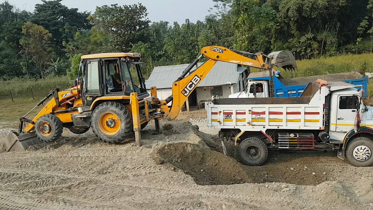 JCB Backhoe Loader Loading Gravel in Dump Truck and Tractor - JCB ...