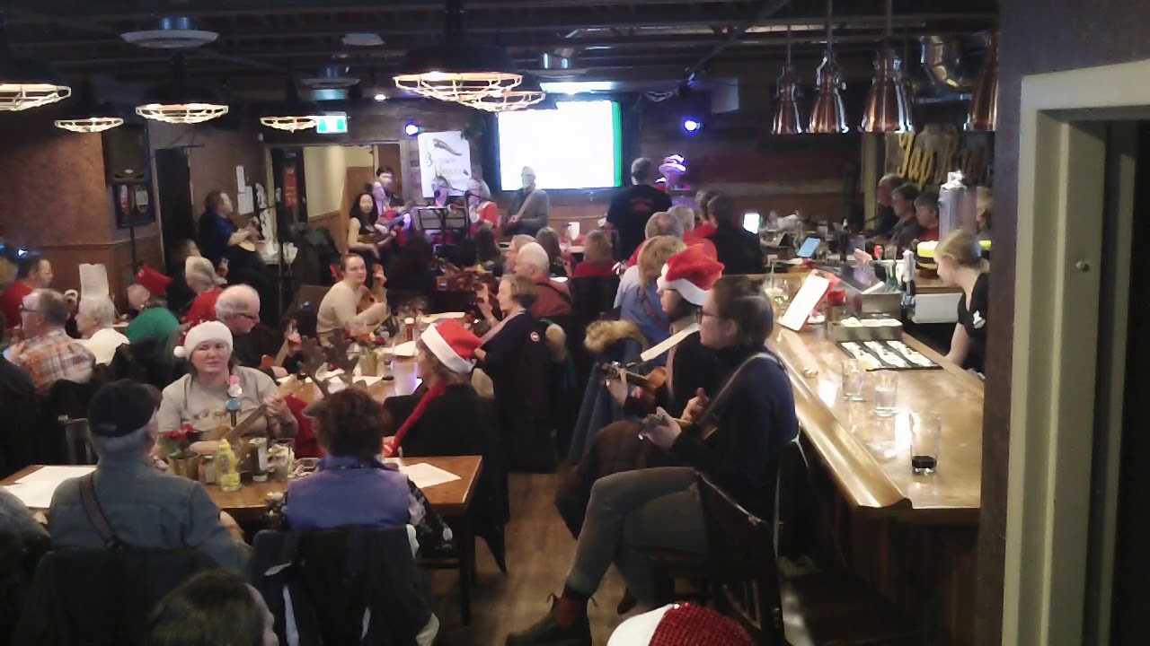 BUG! sings "We Wish You A Merry Christmas" (Arthur Warrell) led by all ...