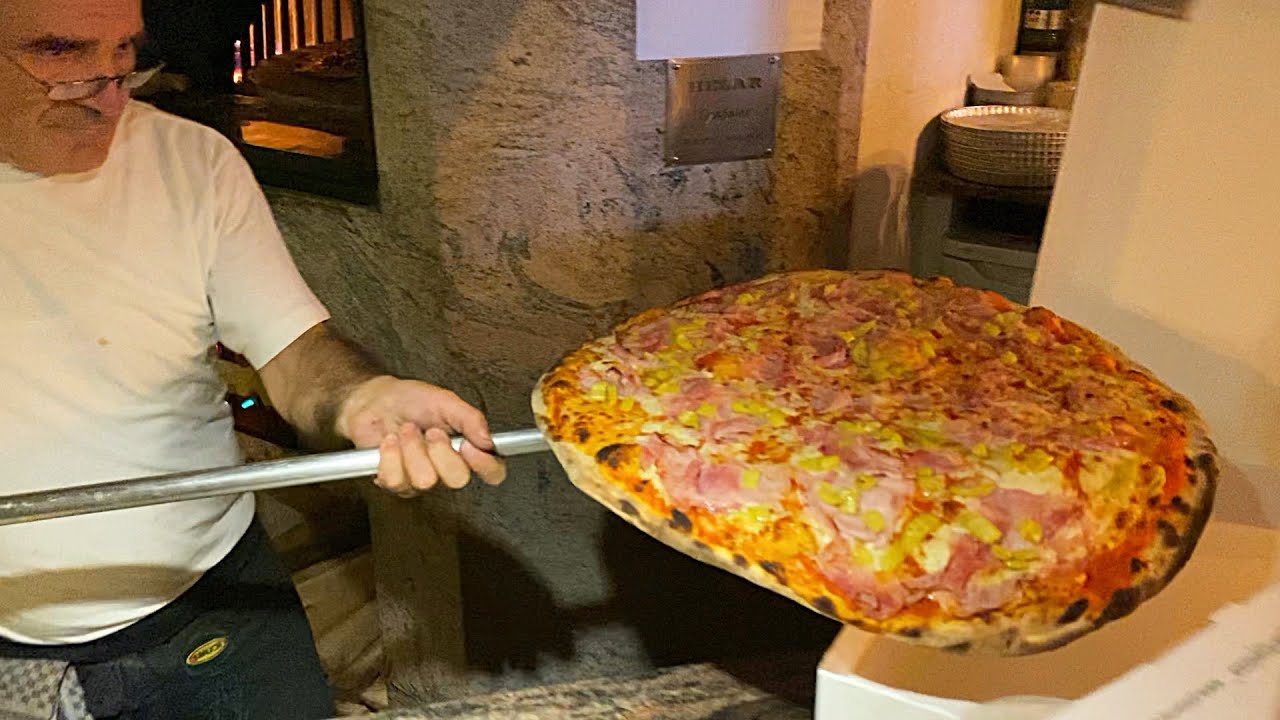 Gigantic 25“ Pizza in Dobner’s incredibl rotating pizza oven on busy ...