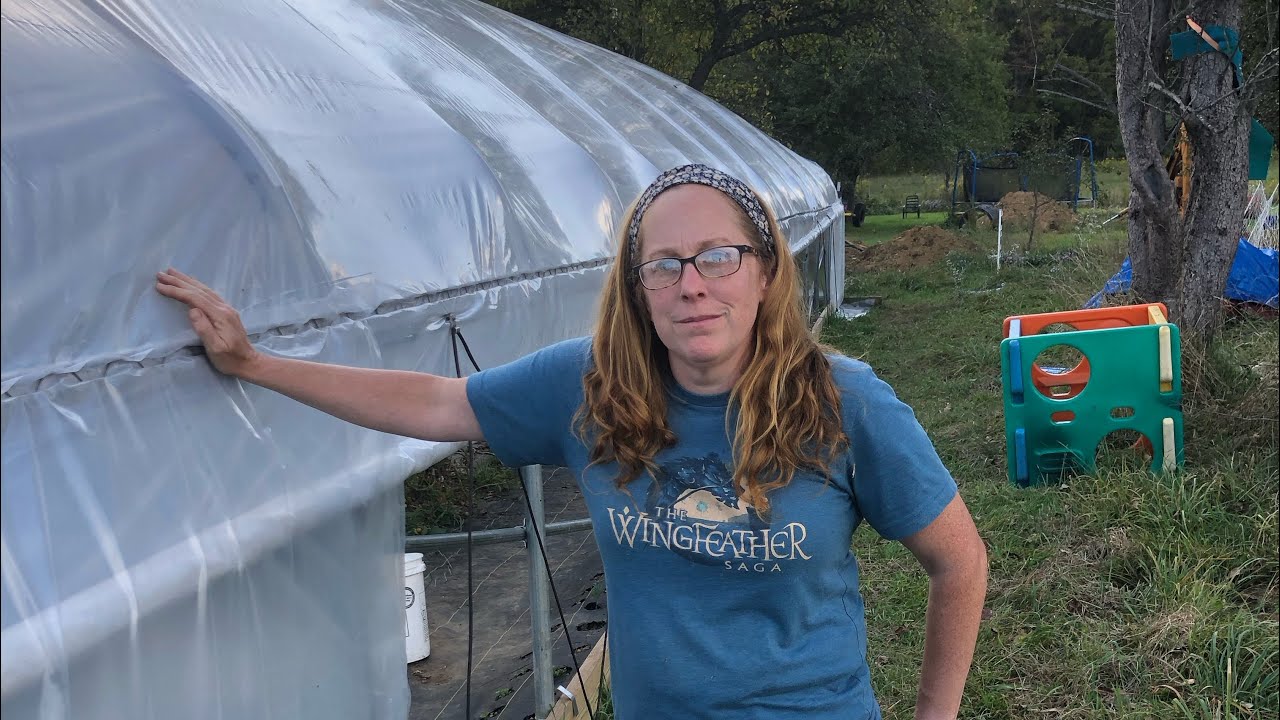 Installing a greenhouse inflation blower to create an insulated air gab ...