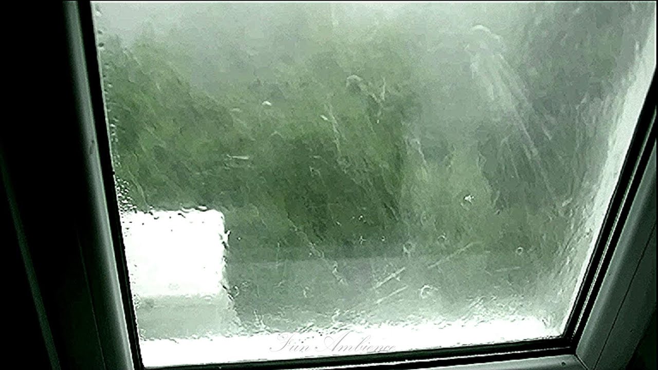 Nature sounds & The view of snow falling on a glass window from the ...