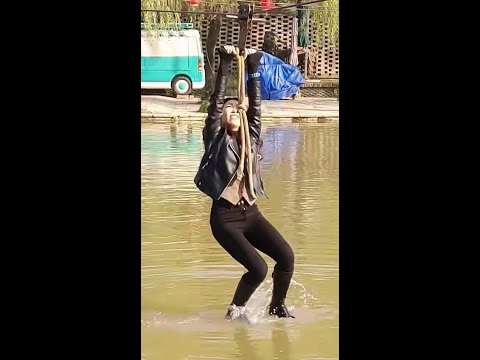 Sexy wet high boots and fall into water