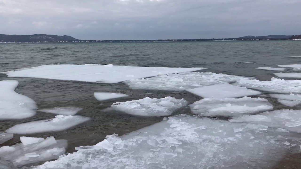 Ice cracking on a lake - YouTube