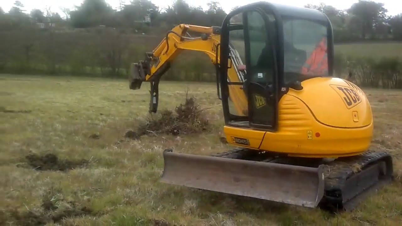 JCB 8045 with RSL fixed thumb grab pulling old briar roots and willow ...
