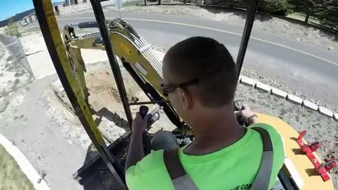 CAT 302.7D Digging Sprinkler Lines. - YouTube