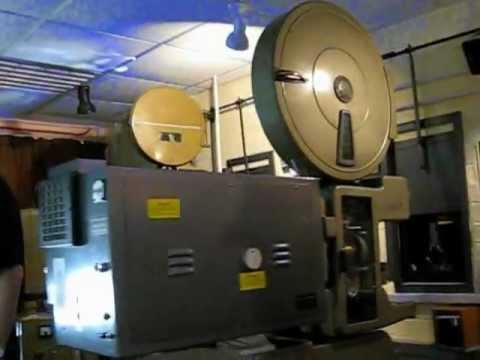 Old 1940s cinema film projectors playing Pathe news reels from WWII ...