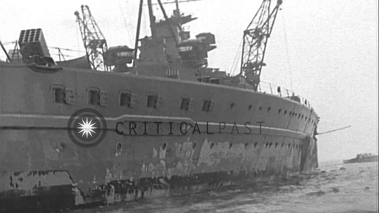 Views from small boat circling HMS King George V, anchored in Halifax ...
