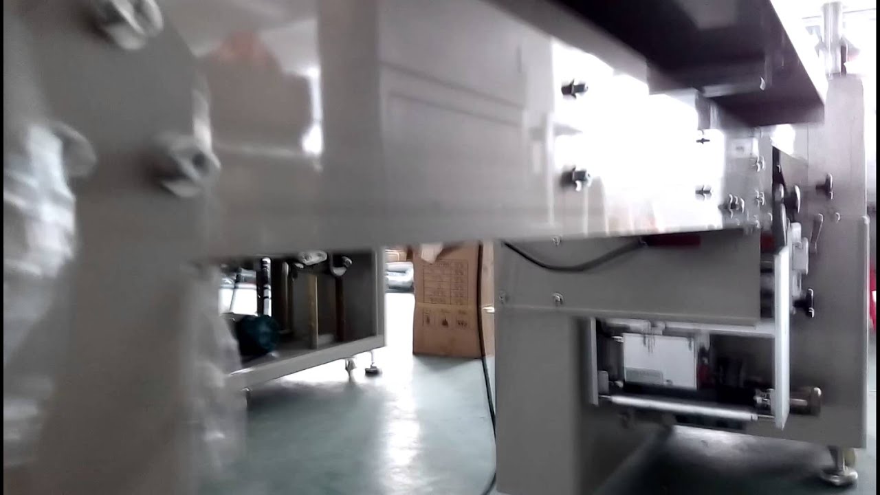 KT 250X down papre flow pack machine for packing stick fruit - YouTube