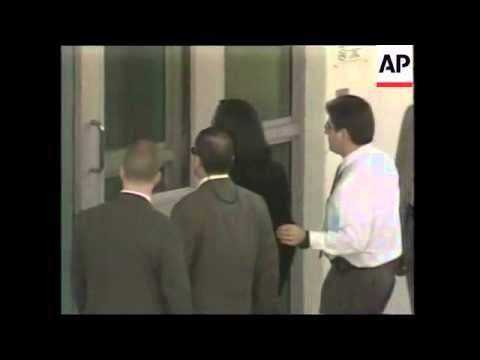 Michael Jackson arriving at court in handcuffs