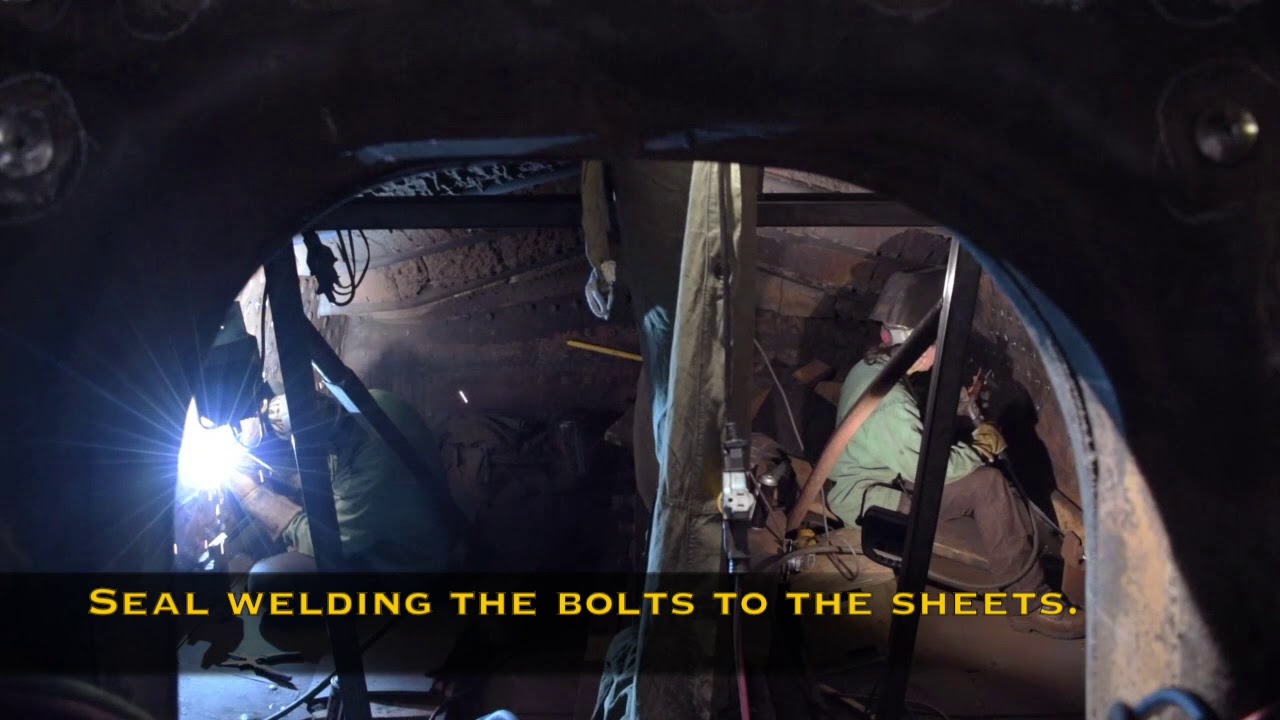 Seal welding staybolts in the firebox of N&W 611 - YouTube