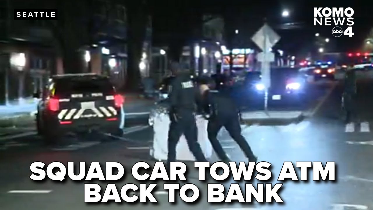 Raw video: Seattle police tow stolen ATM back to Wallingford bank - YouTube