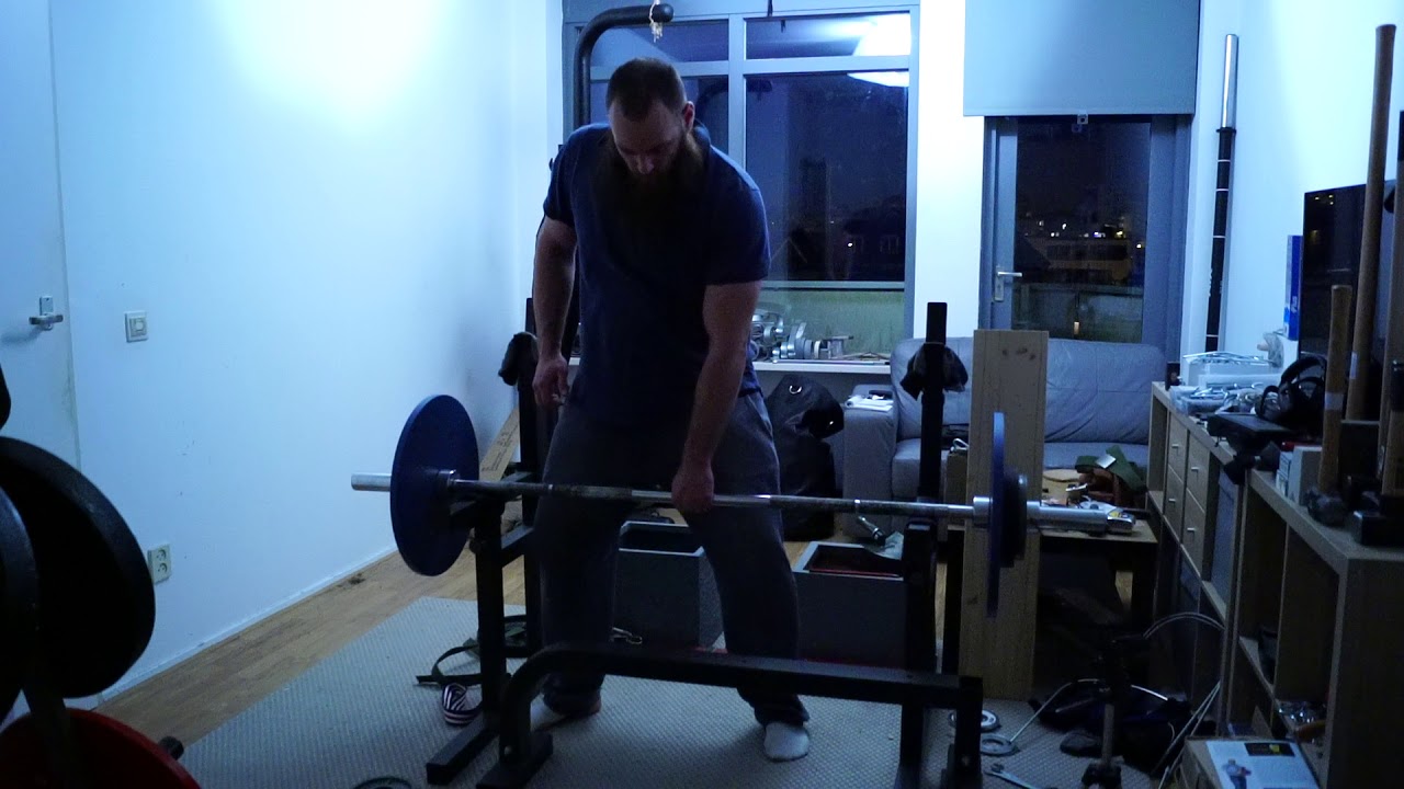 70 KG one handed barbell grip lift and hold from the rack with the left ...