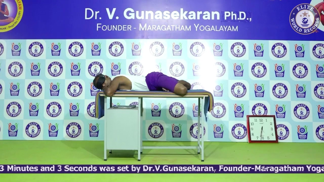 Longest TimeHolding Guptasana Yoga Pose Blindfolded on a Table by an ...