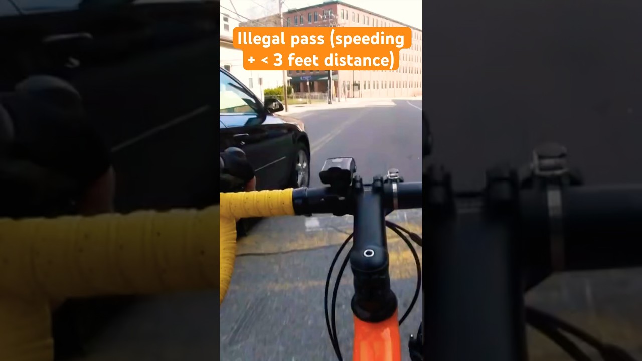 Speed Bump Jump! Driver passes cyclist illegally as they hit speed bump ...