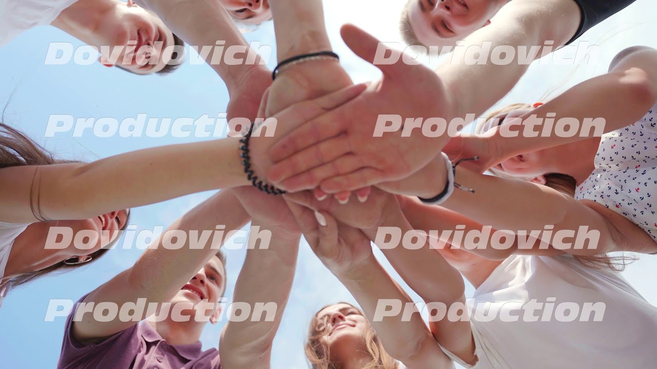 Friendly friends clasp hands as a sign of strong friendship and ...