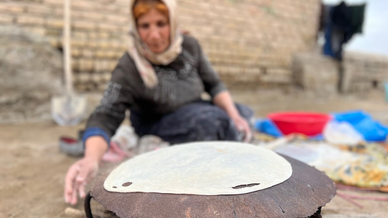Cooking Tiri bread on a snowy day in the village of Iran: village ...