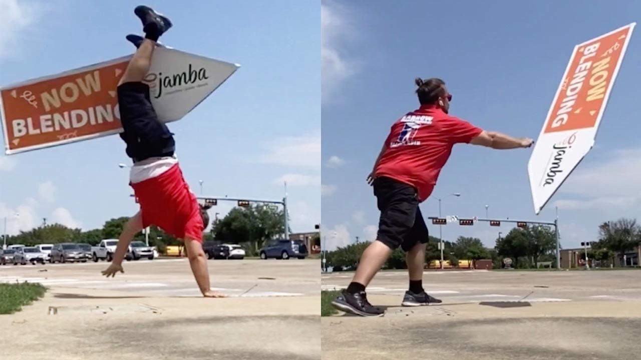 Man Has Impressive Sign Spinning Skills - YouTube