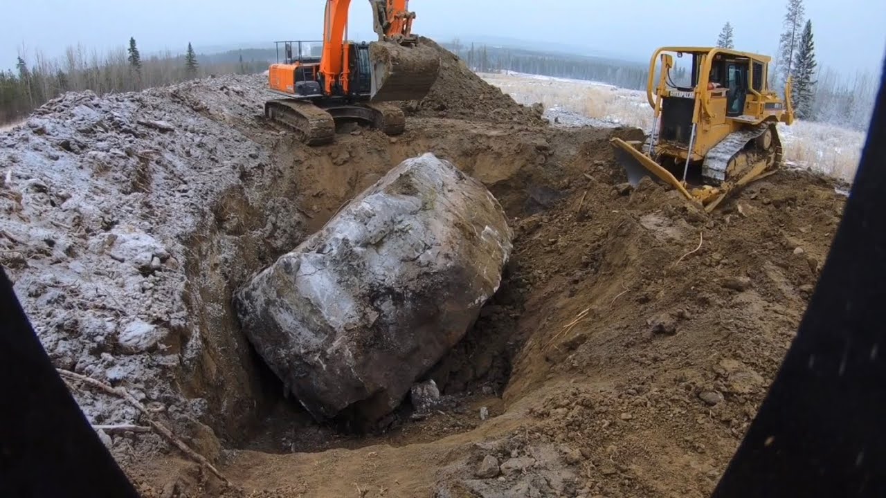 Rolling Giant Rocks off Pipeline Ditch-Line - YouTube