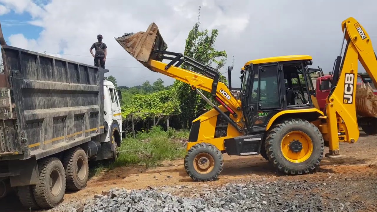 jcb loading gravel in a dump truck - YouTube