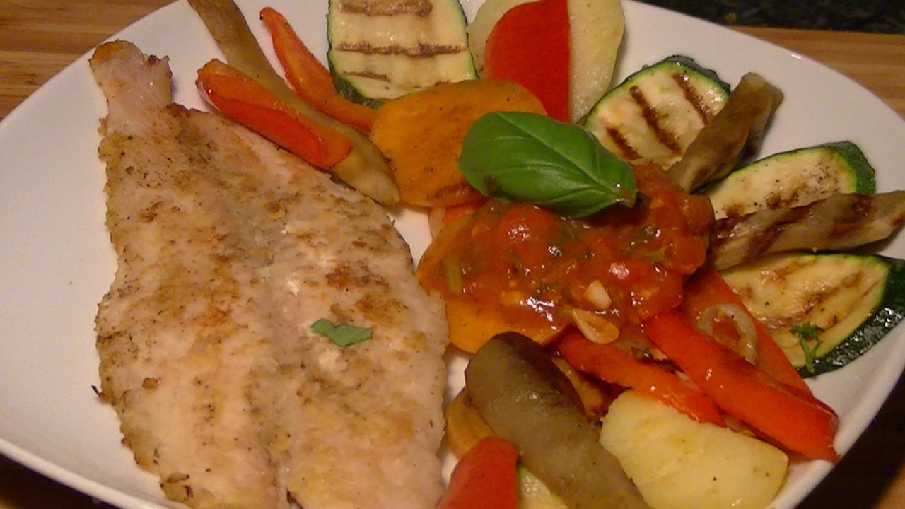 Tasty Fish fillets with grilled vegetables and tomato-pepper sauce ...