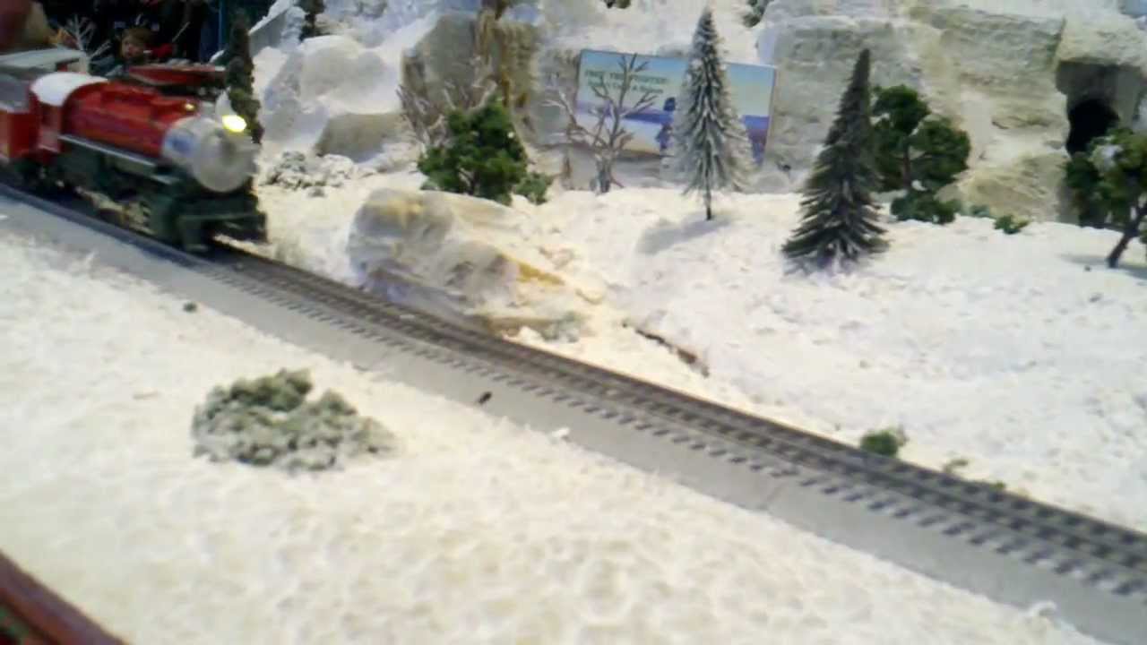 H.O. scale Model Train in the snow going through a tunnel - YouTube