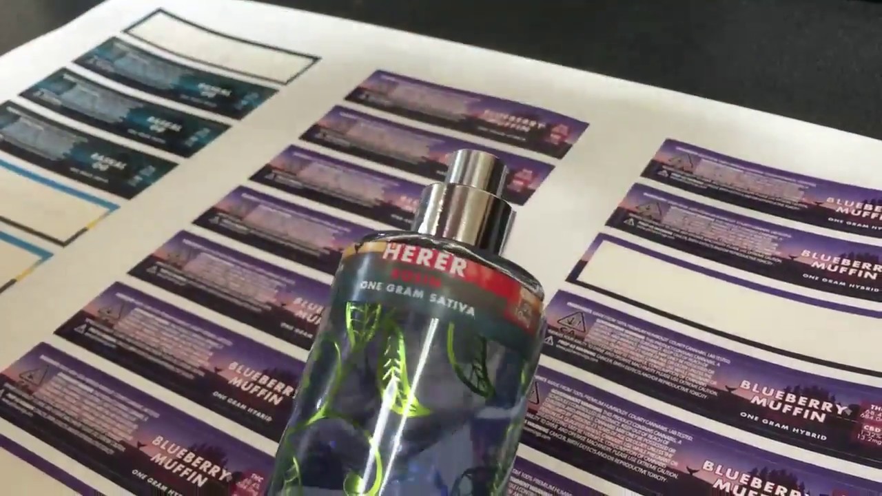 Perforated custom printed labels used as tamper resistant bottle seals ...