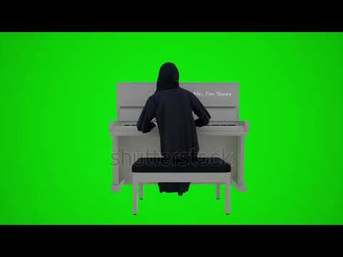 3d green screen an Arab female employee playing the piano in Dubai restaurants from the back angle