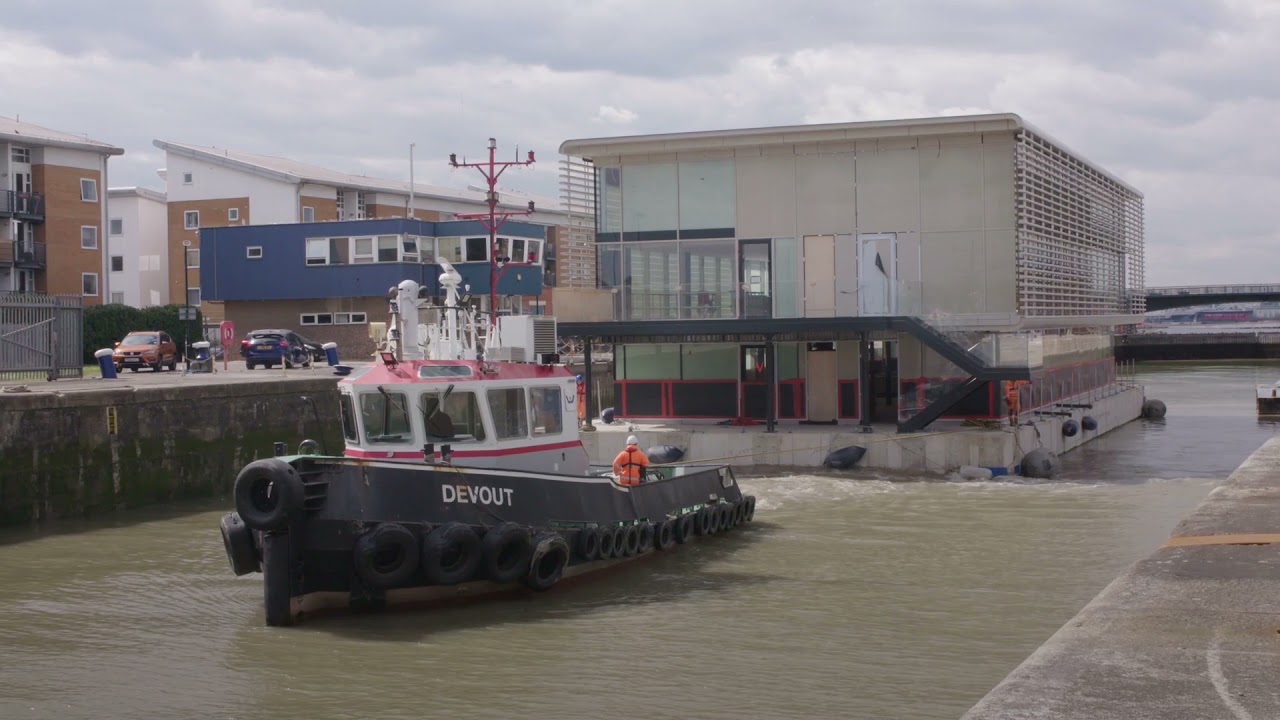 Floating pavilions sail into the docks of Canary Wharf - YouTube
