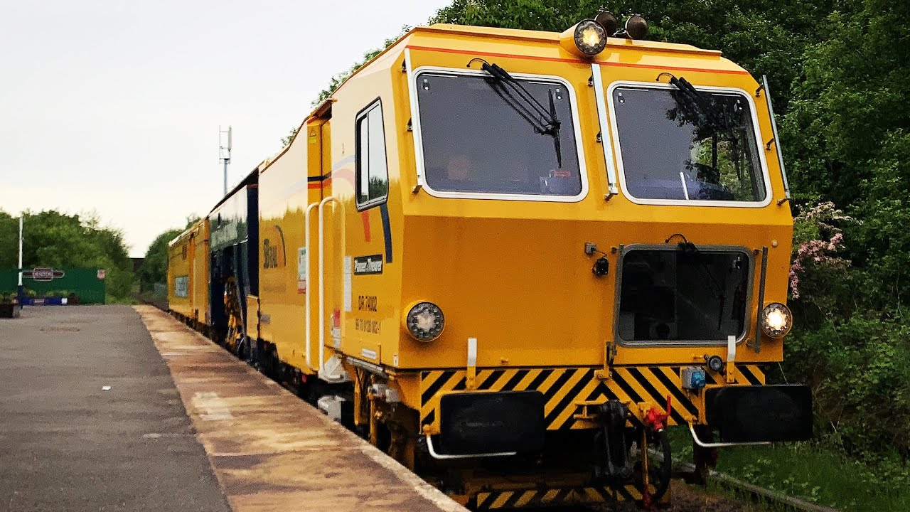 SB Rail tamper DR74002 Coasts past Denton working 6J60 - YouTube