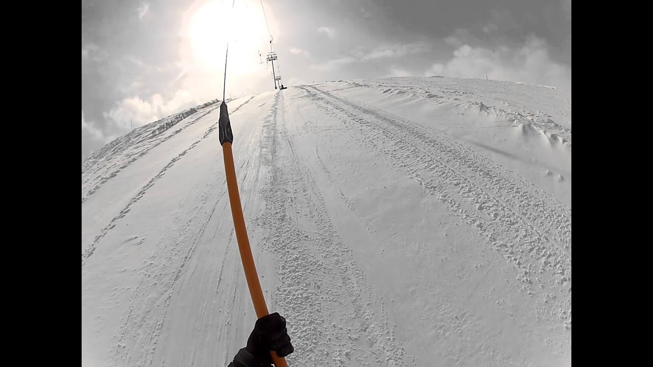 How to ride a T-bar lift with a snowboard... or drag behind it - YouTube