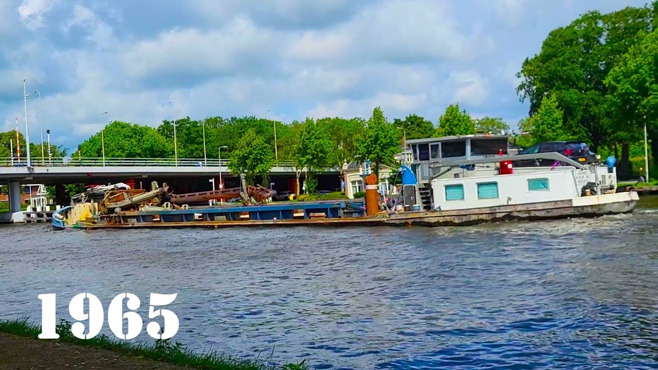 Heavily overloaded Barge. But it has the advantage of passing under the ...
