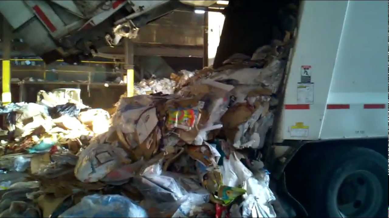 Garbage Truck Dumps Paper - YouTube
